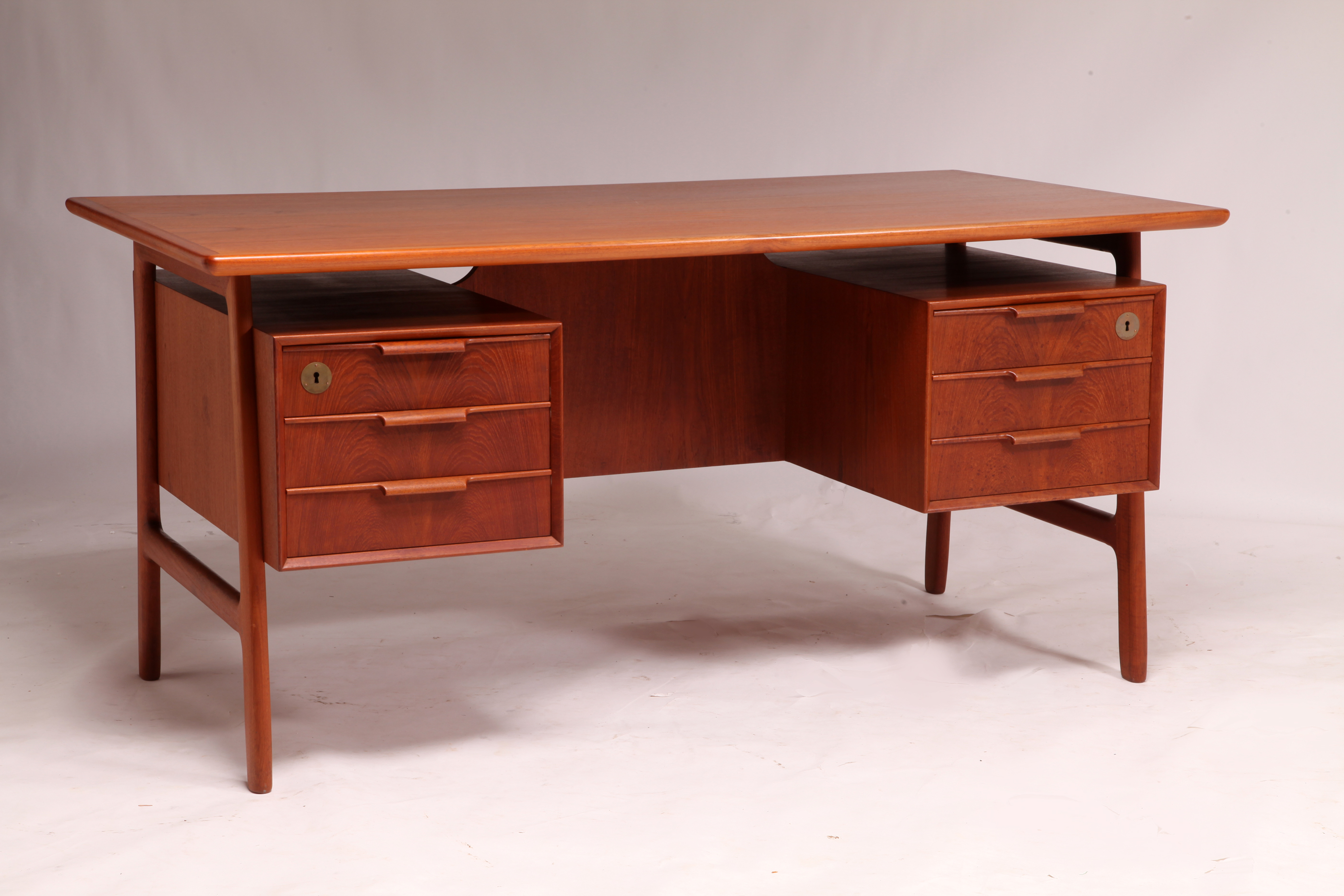 Model 75 desk in teak by Omann Jun | Swanky Systems